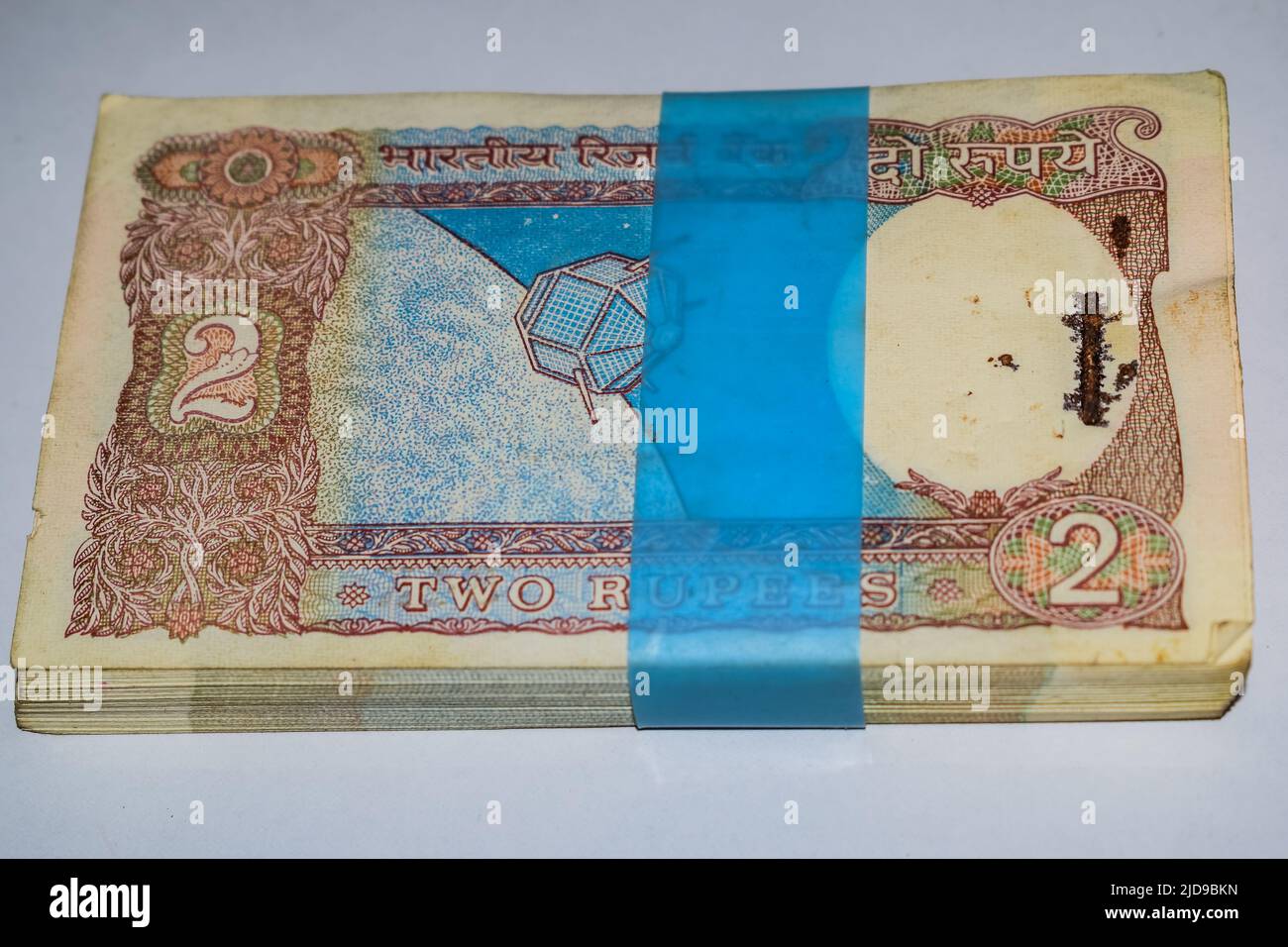 Old Two Rupee notes combined on the table, India money on the rotating ...