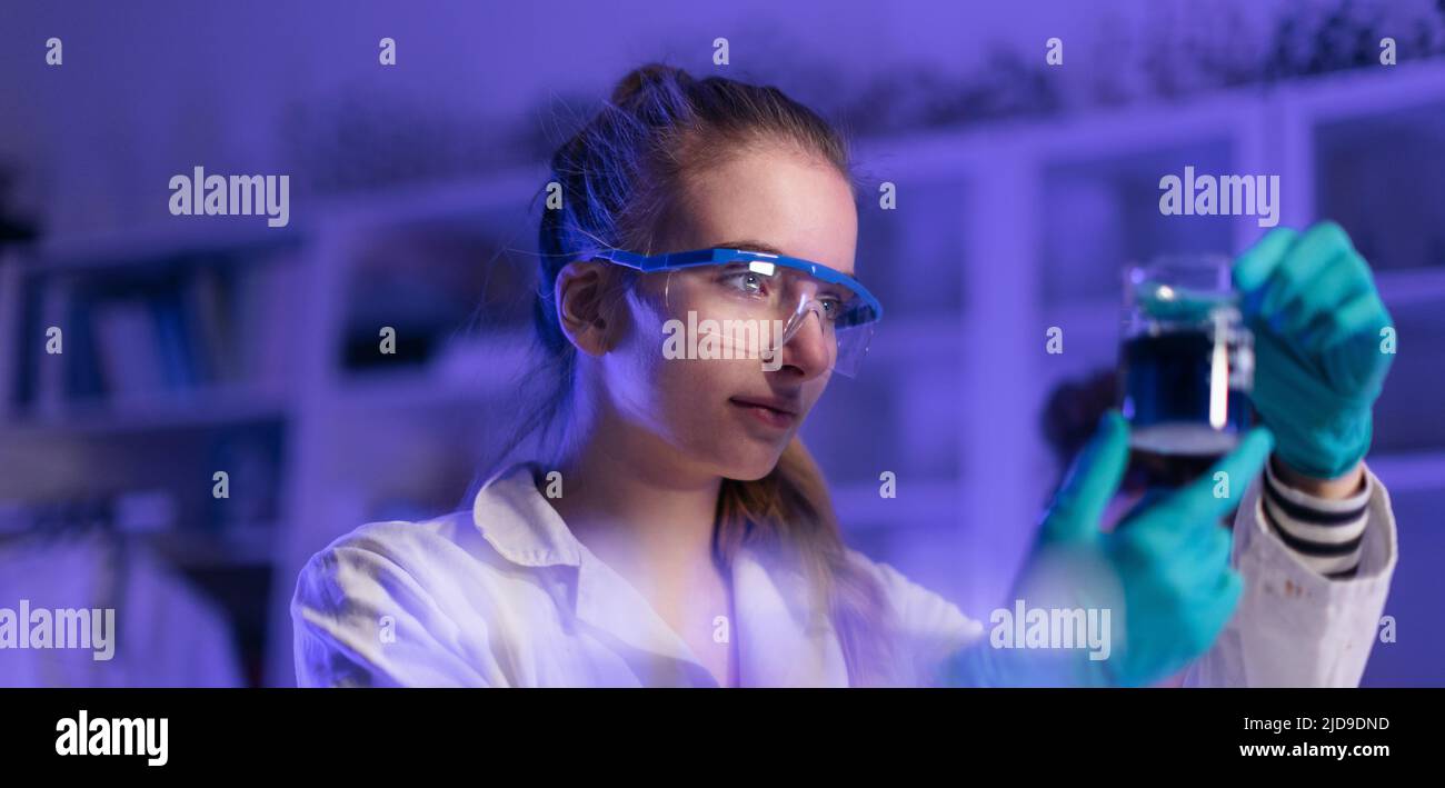 Science student doing chemical experiment in the laboratory at ...