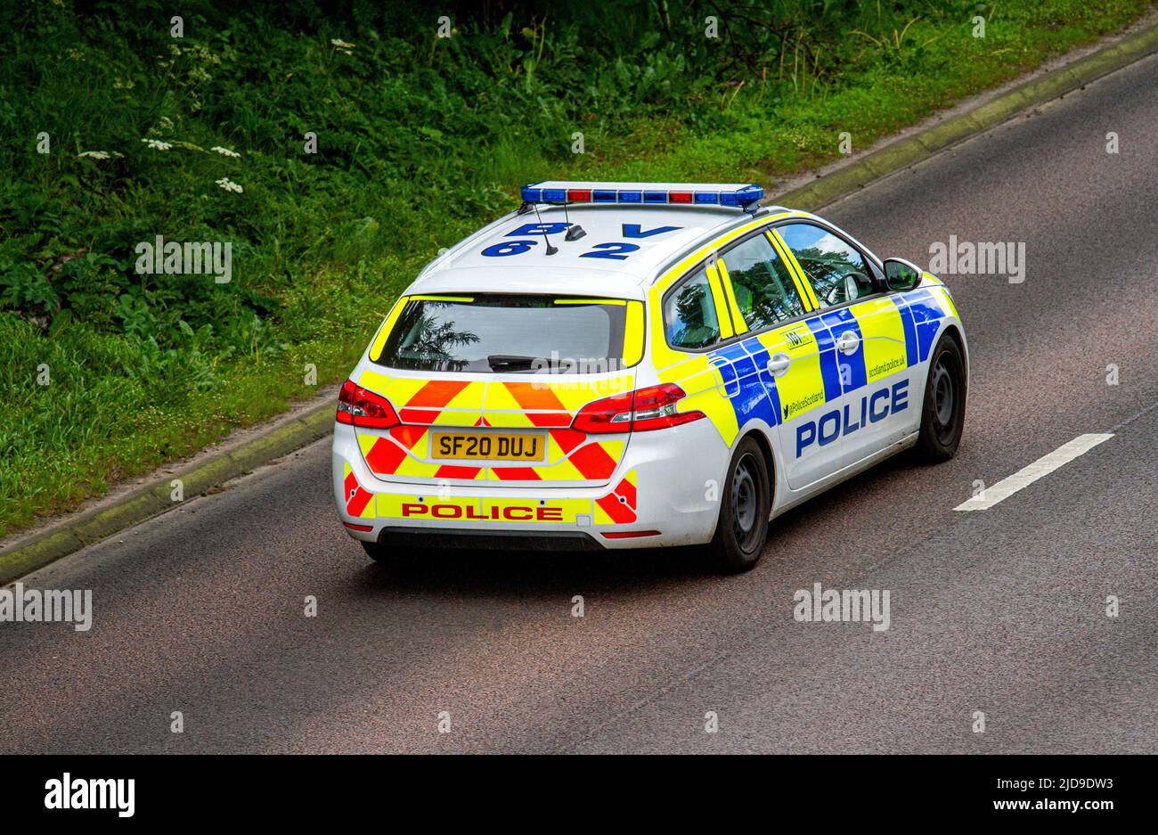 A Police Scotland police car is motoring along the Kingsway West dual ...