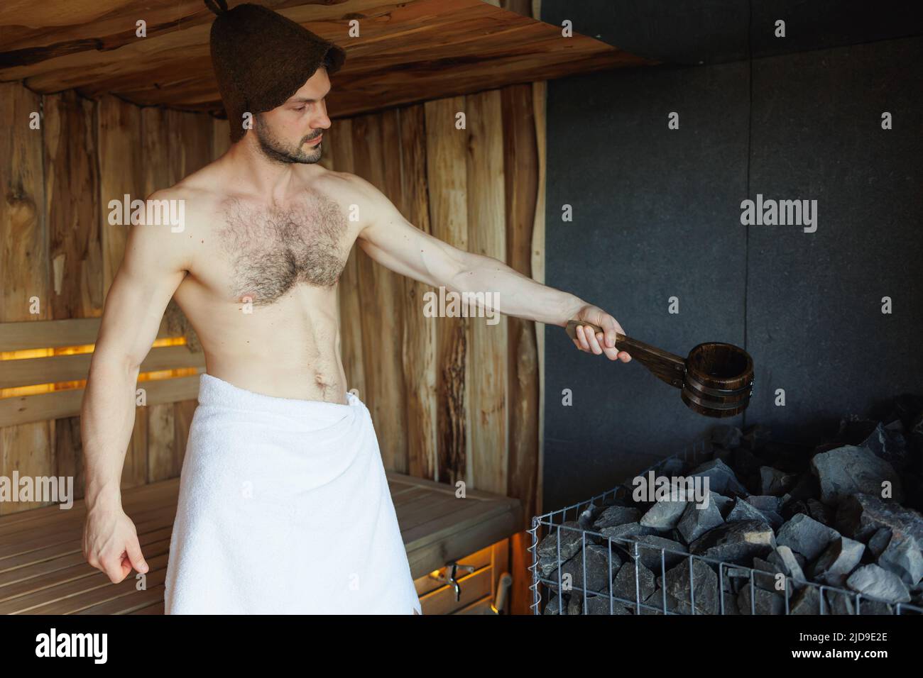 Young man pours water hi-res stock photography and images - Alamy