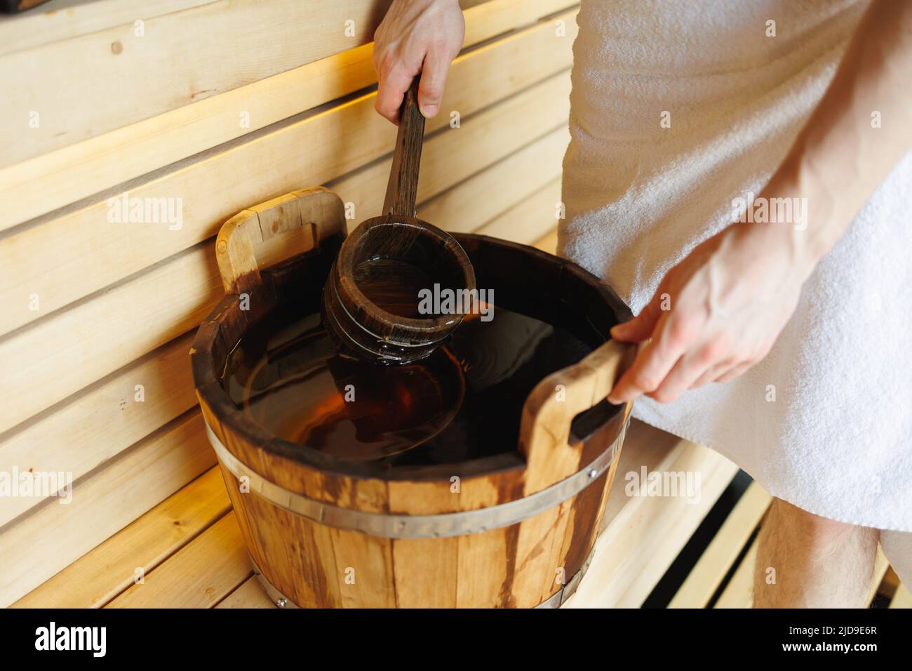 Man pouring bucket water hi-res stock photography and images - Alamy