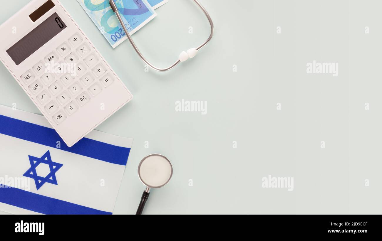 Medical insurance in Israel. Calculator, stethoscope, Israeli flag and ...