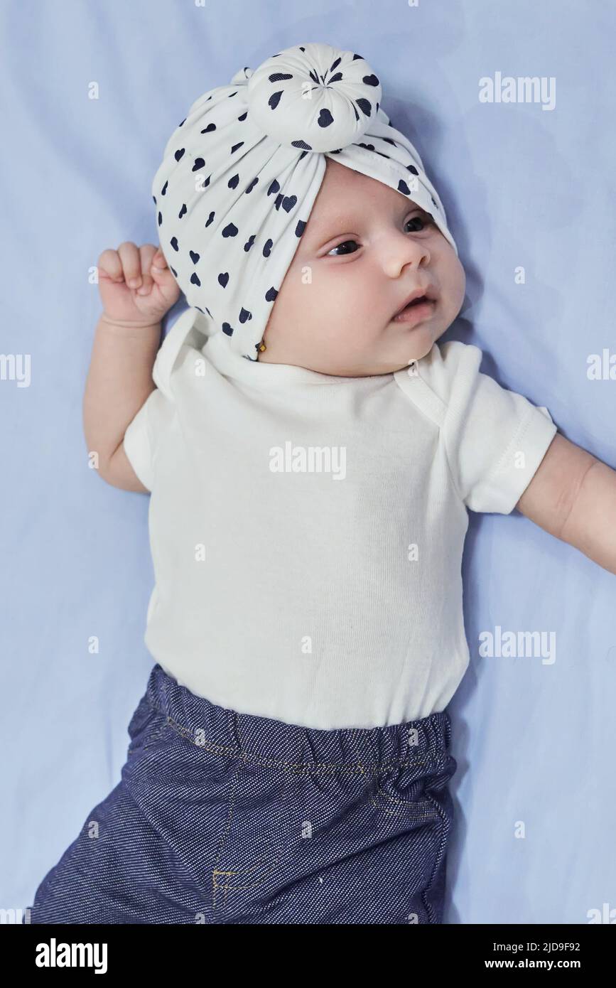 Close-up of cute little funny baby girl wearing a white turban Stock ...