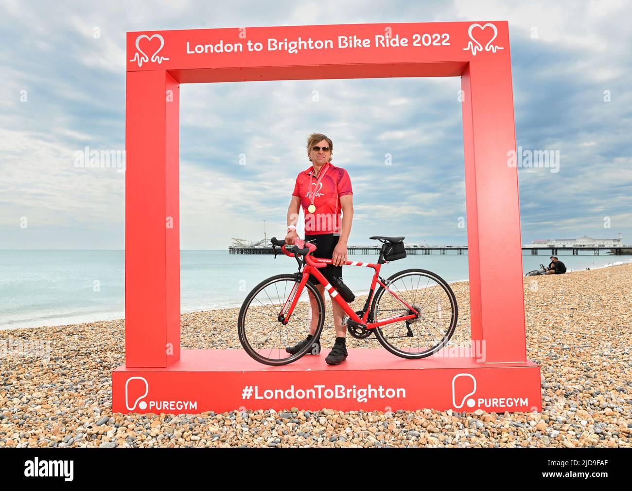 EDITORIAL USE ONLY Musician Jason Cooper stands on the beach at ...