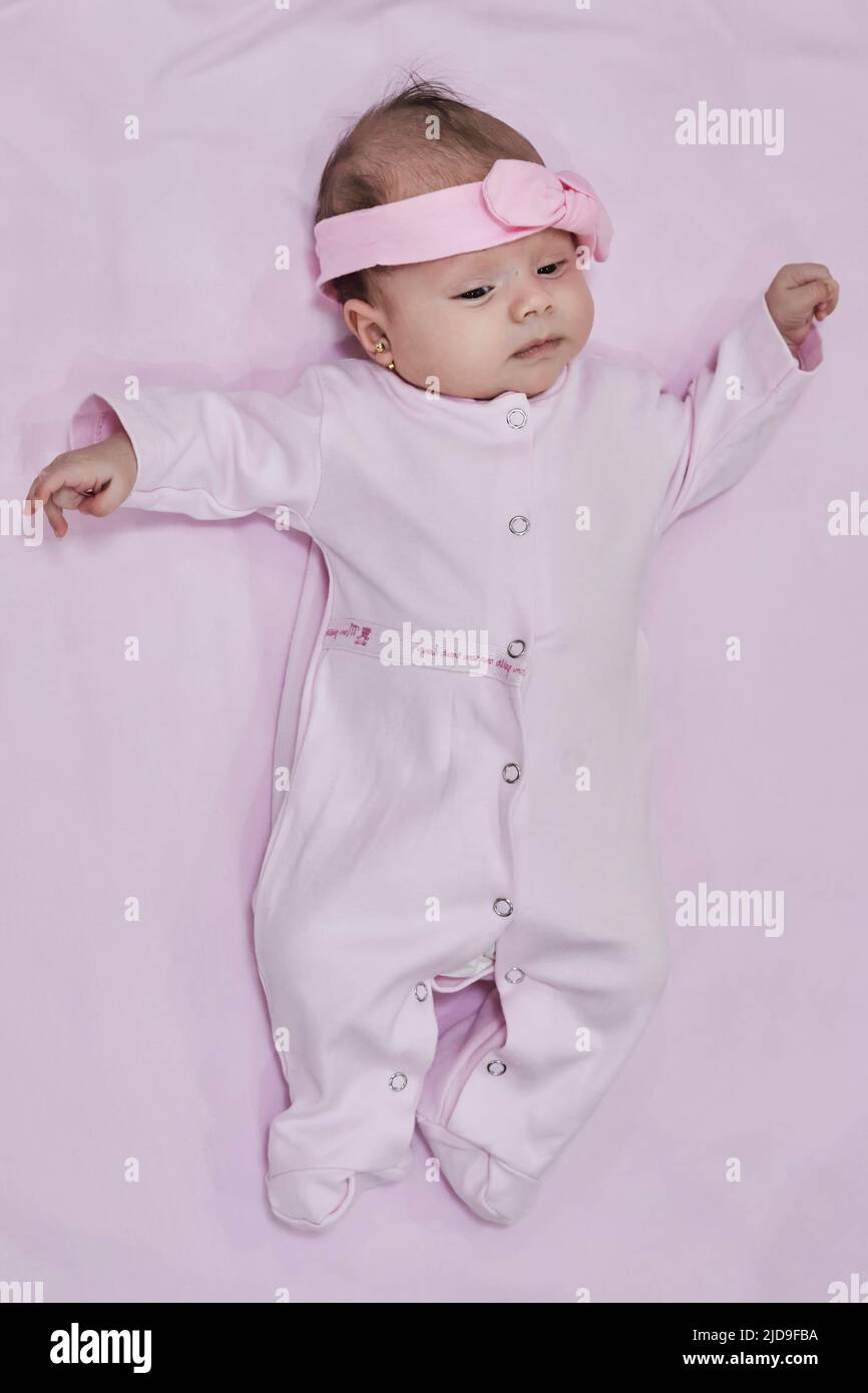 Newborn baby girl sleep on pink blan. Close up Stock Photo - Alamy