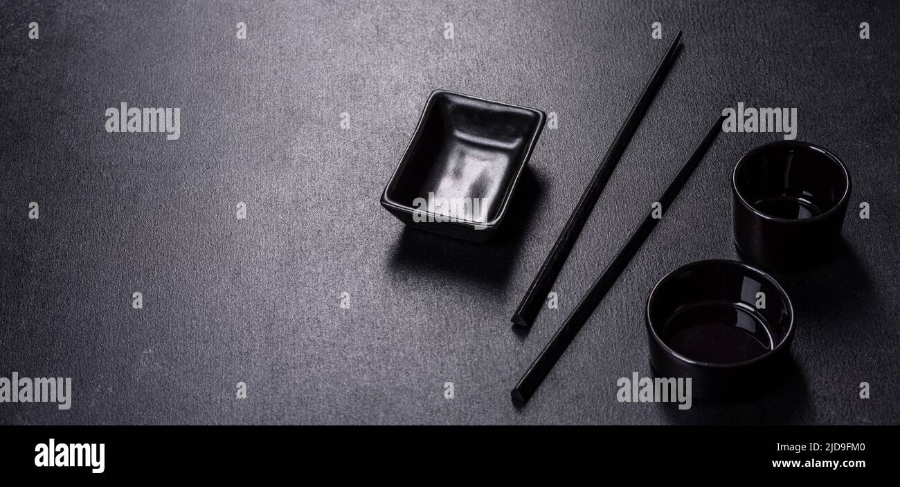 Wooden sushi sticks on a dark concrete background. Japanese Asian ...