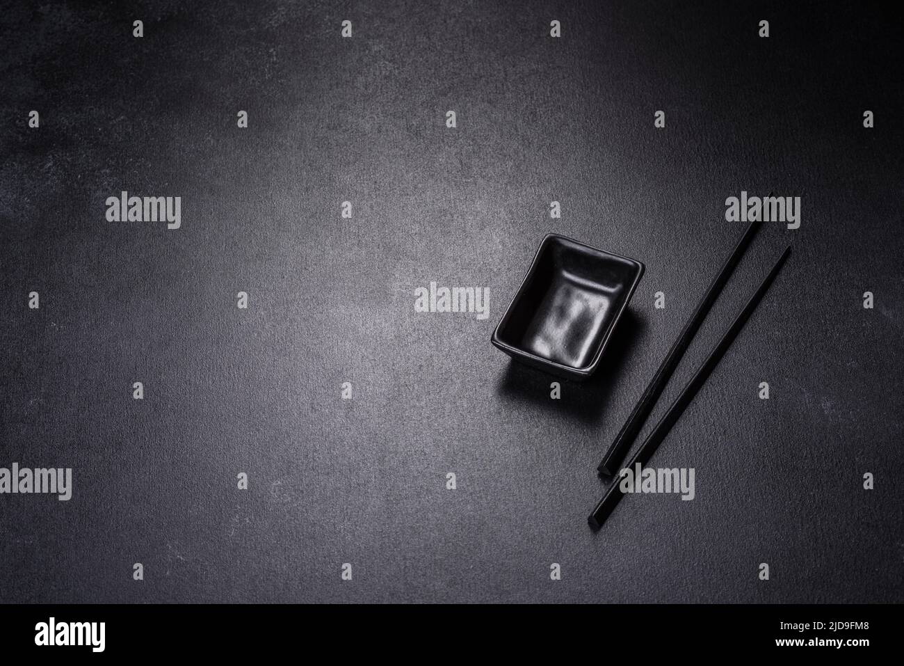 Wooden sushi sticks on a dark concrete background. Japanese Asian ...