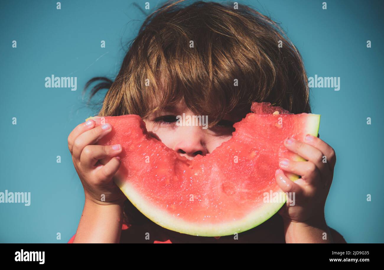 Closeup of funny child eating sweet watermelon Stock Photo - Alamy