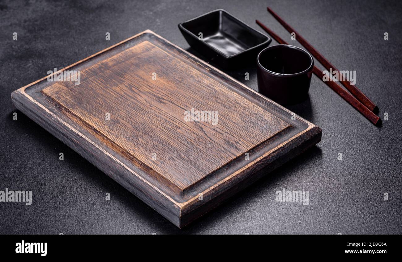 Wooden sushi sticks on a dark concrete background. Japanese Asian ...