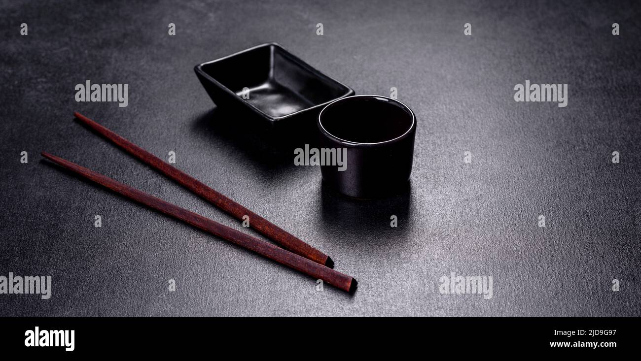 Wooden sushi sticks on a dark concrete background. Japanese Asian ...