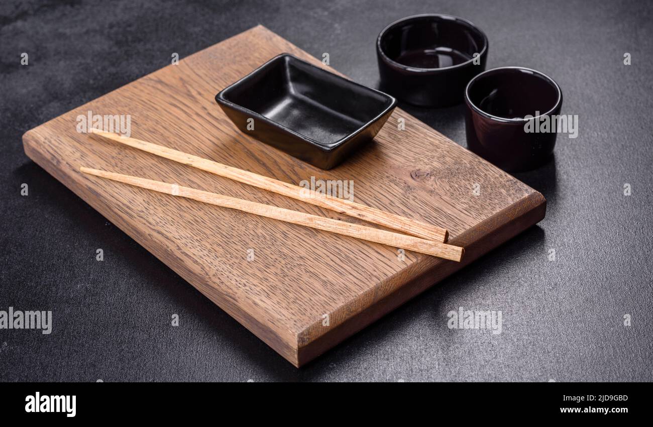 Wooden sushi sticks on a dark concrete background. Japanese Asian ...