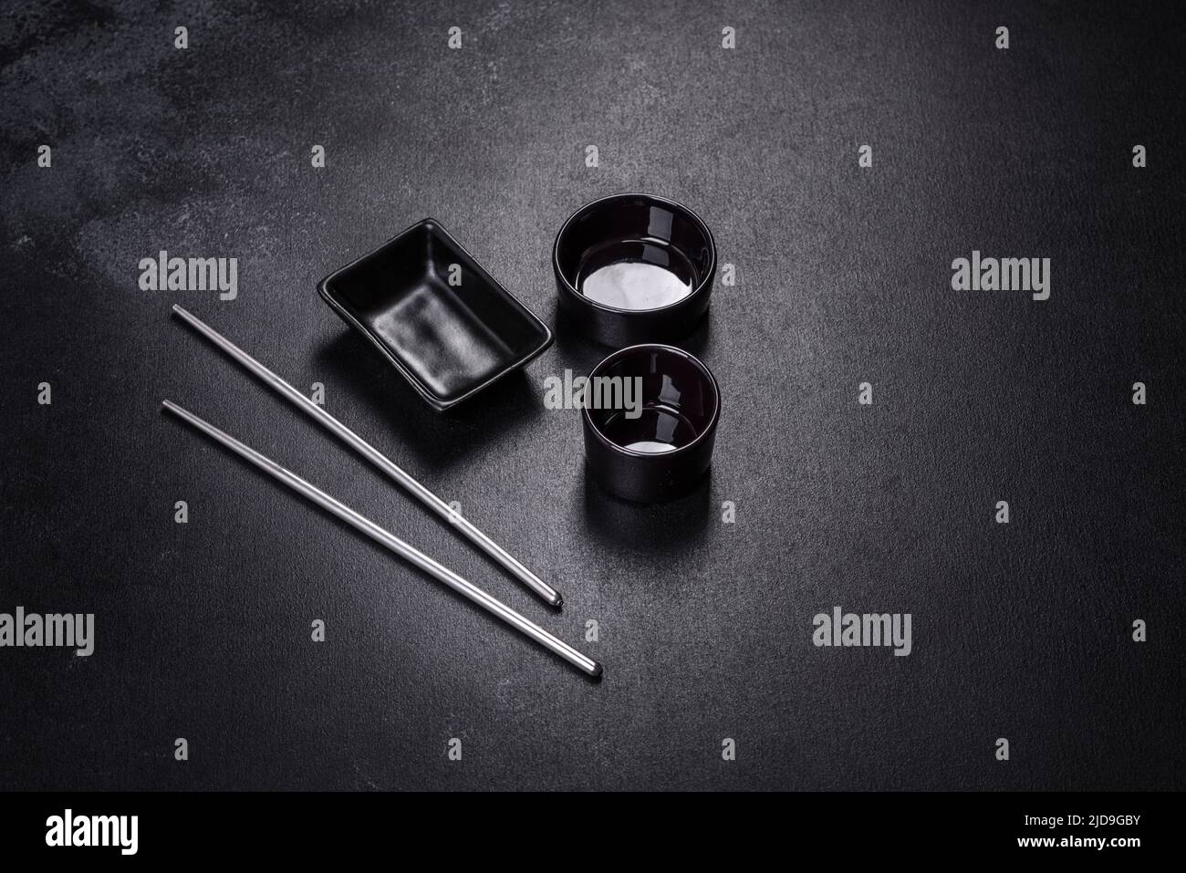 Wooden sushi sticks on a dark concrete background. Japanese Asian ...