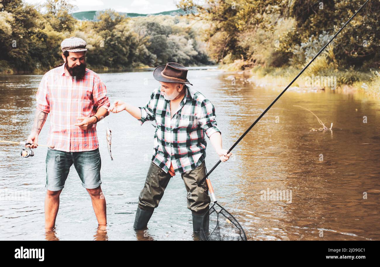 Fly angler on the river. Angler. Family and generation - summer ...