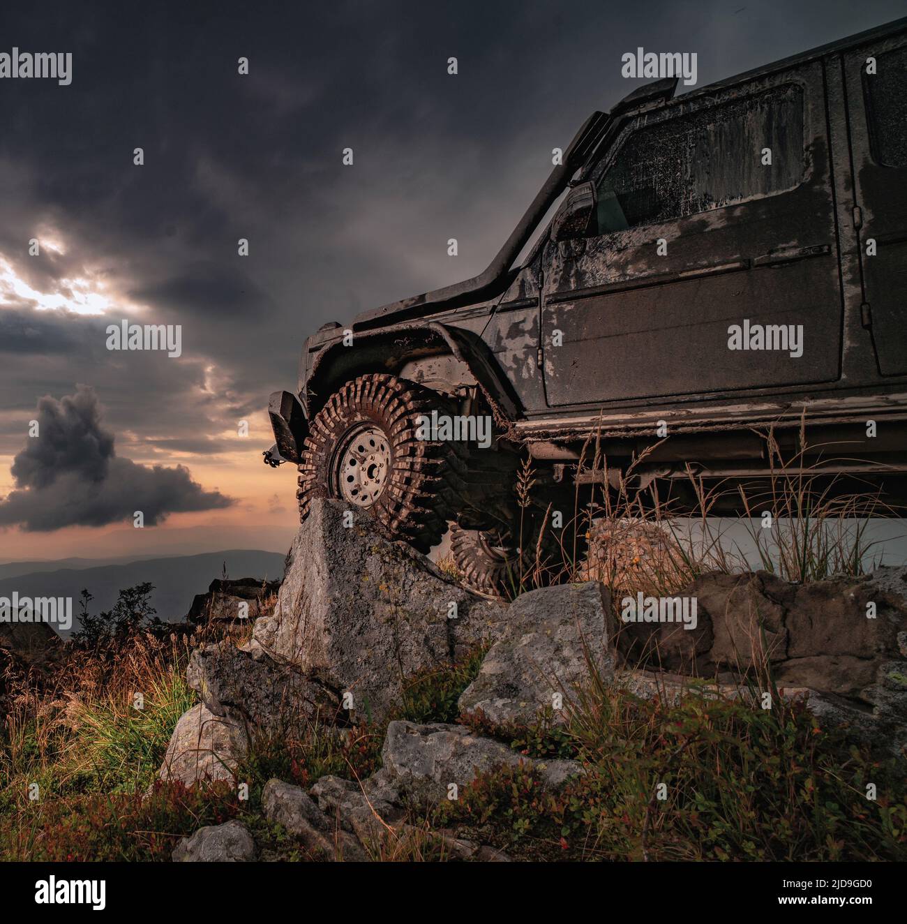 Car brakes with absorbers. Car tire. Off-road travel on mountain road ...
