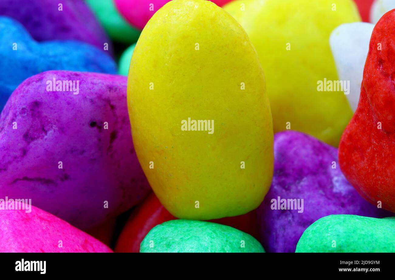 close-up colorful painted pebbles background Stock Photo - Alamy