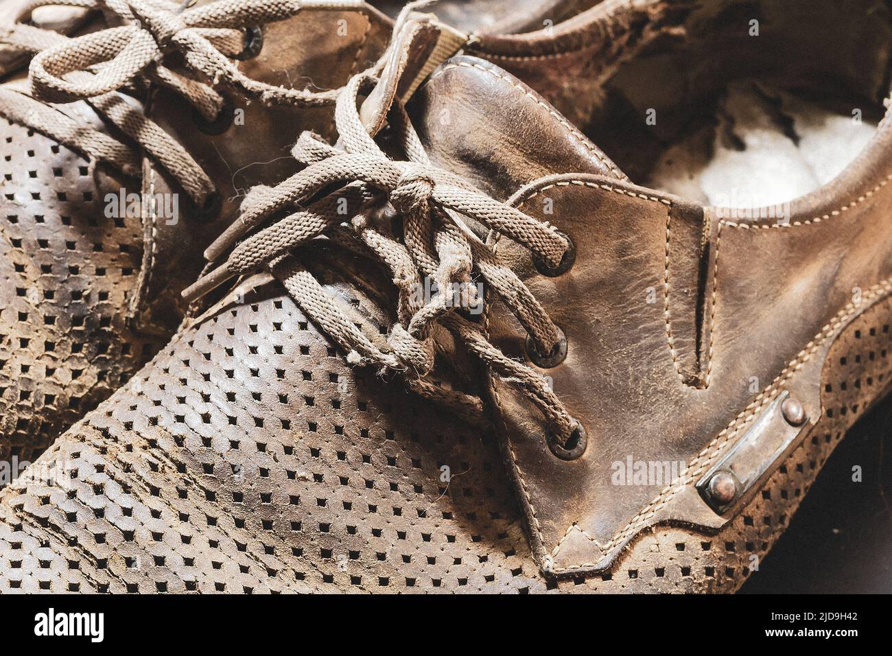 Pair of ripped shoes torn hi-res stock photography and images - Alamy