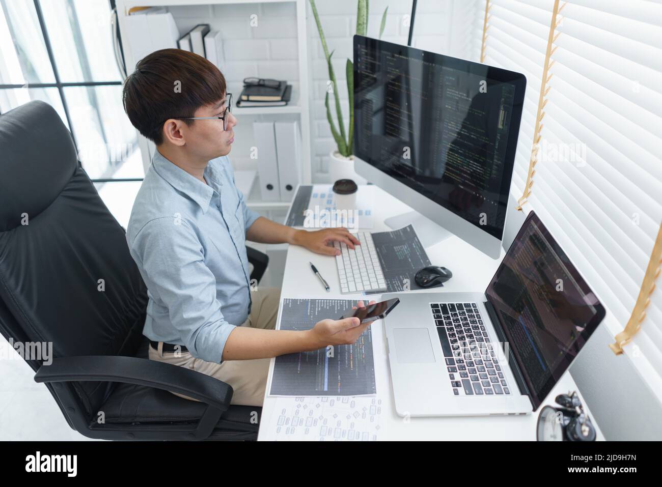 Software development concept, Male programmer check website programming ...