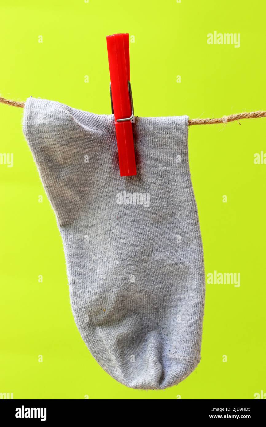 Socks hanging on a clothesline Stock Photo - Alamy