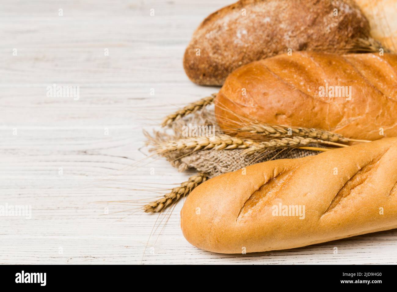 Homemade natural breads. Different kinds of fresh bread as background ...