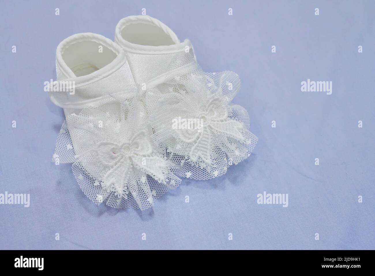 Handmade white baby booties. Little baby booties Stock Photo - Alamy