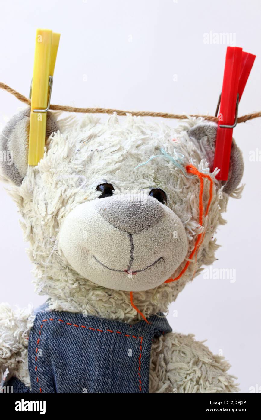 cute teddy bear hanging on rope Stock Photo - Alamy