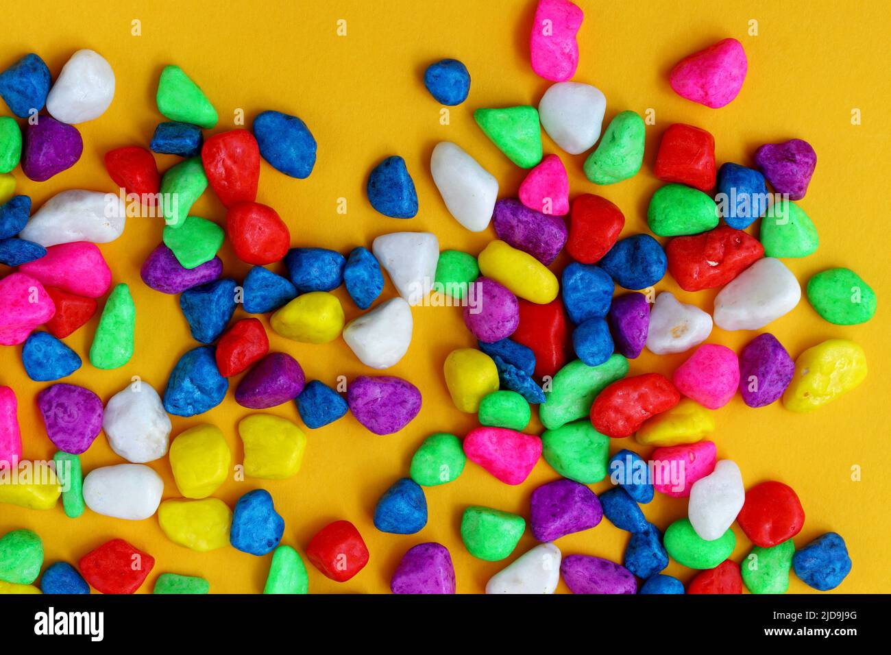 close-up colorful painted pebbles background Stock Photo - Alamy