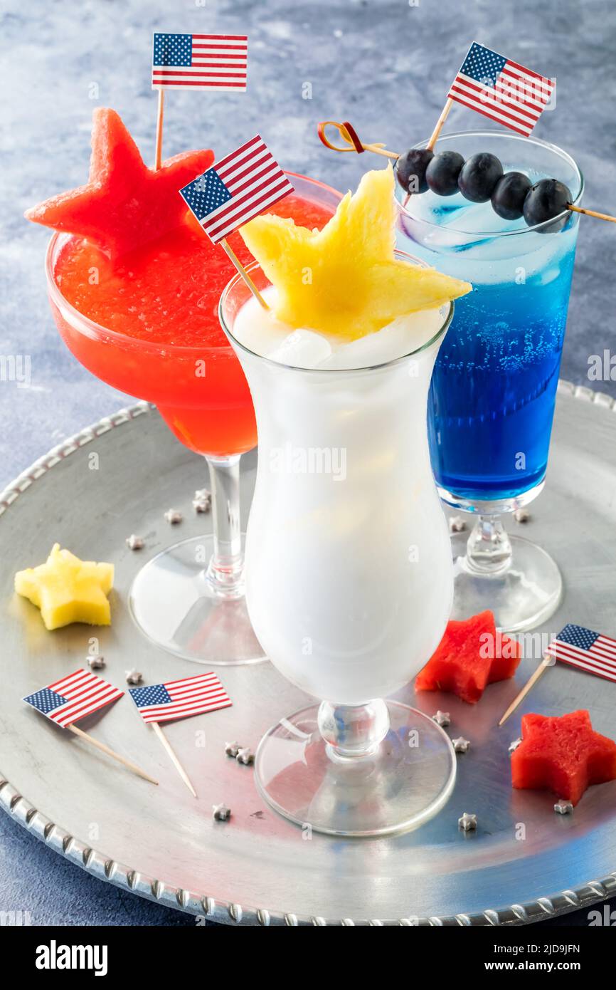 4th of July cocktails garnished with patriotic flags and fruit stars ...