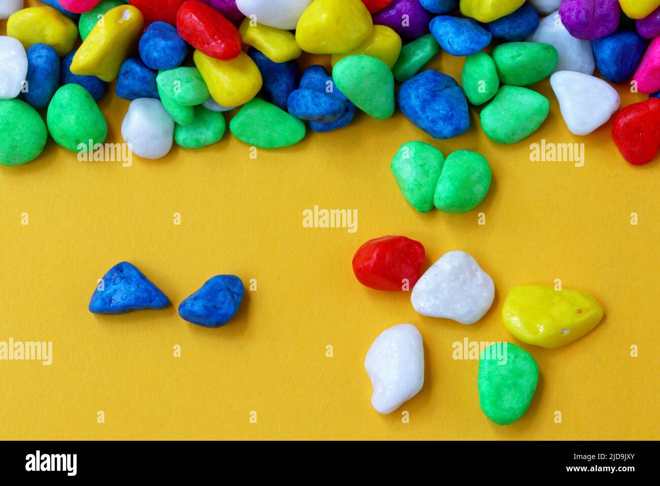 close-up colorful painted pebbles background Stock Photo - Alamy