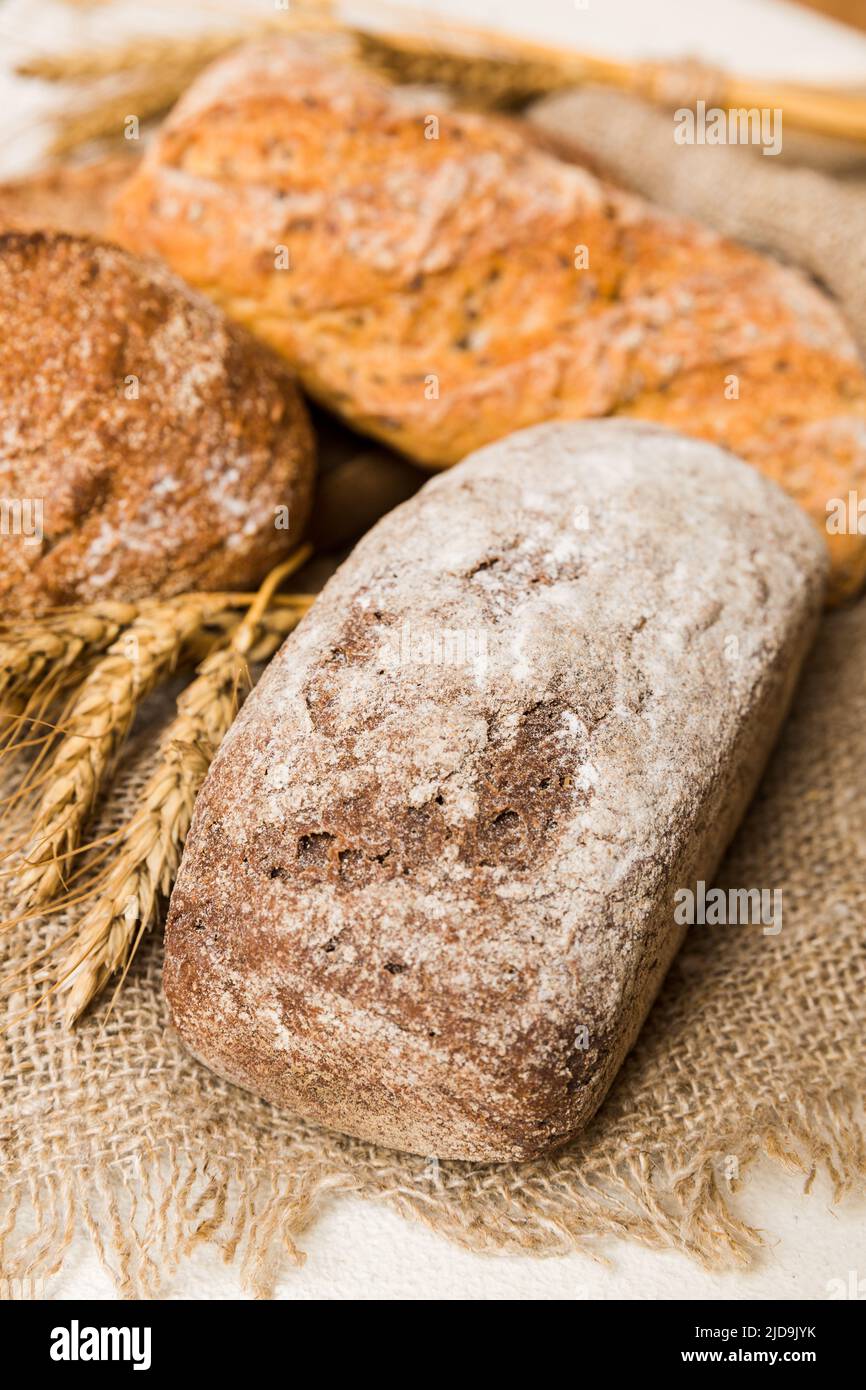Homemade natural breads. Different kinds of fresh bread as background ...