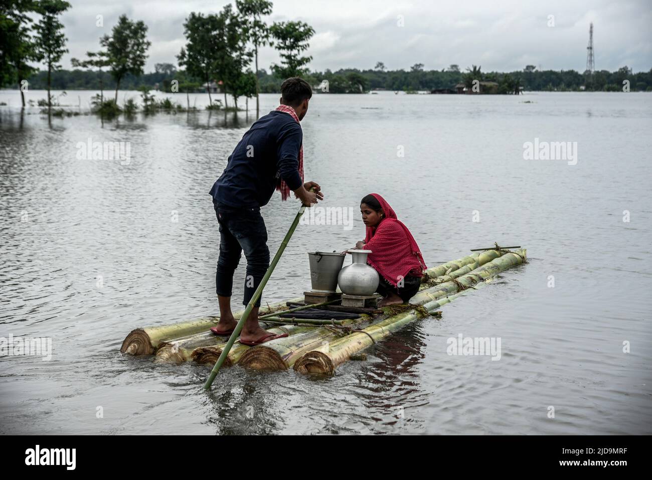 Flood affected people travel on a banana raft as they are going to a ...