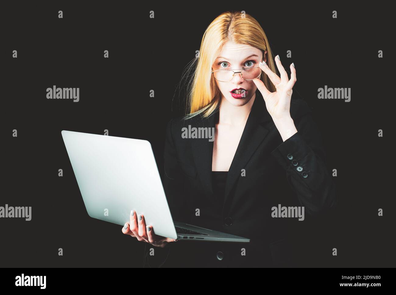 Sensual secretary business woman holding laptop, black isolated ...