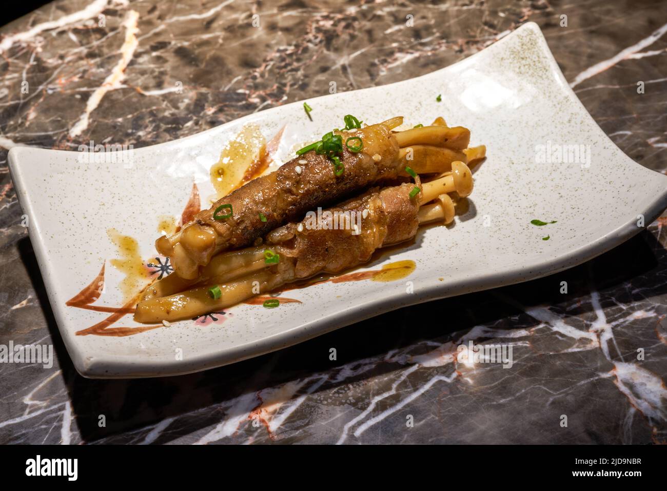 A delicious Japanese dish, Fatty Beef Enoki Mushroom Roll Stock Photo ...