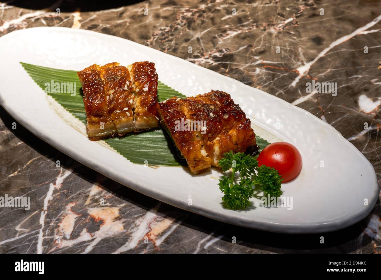 A delicious Japanese dish, rock grilled eel Stock Photo - Alamy