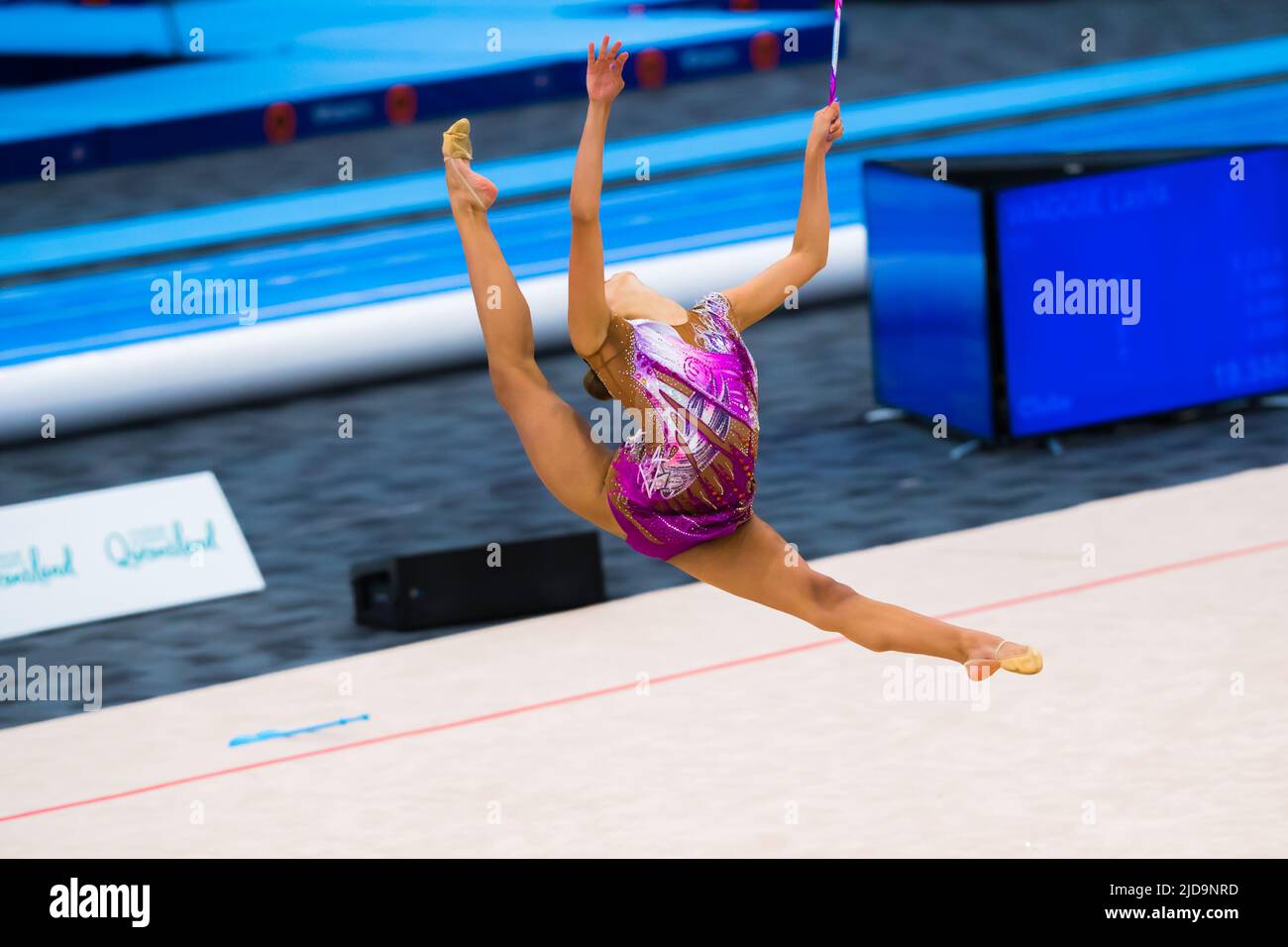 Australian Senior International Rhythmic Gymnast, Ashari Gill is arching back during split leap ...