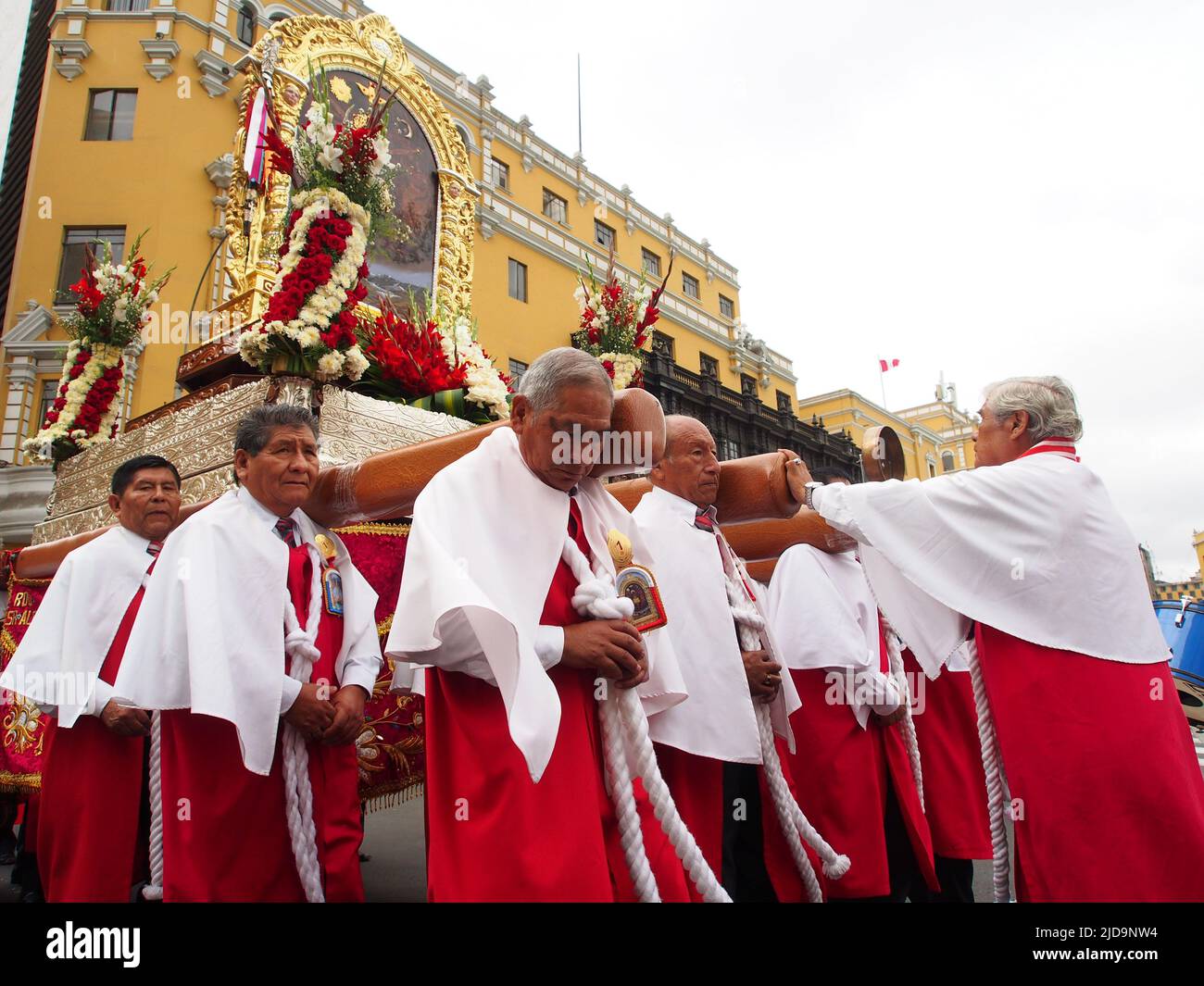 Devotees carrying a religious litter when hundreds of Quechua-speaking ...