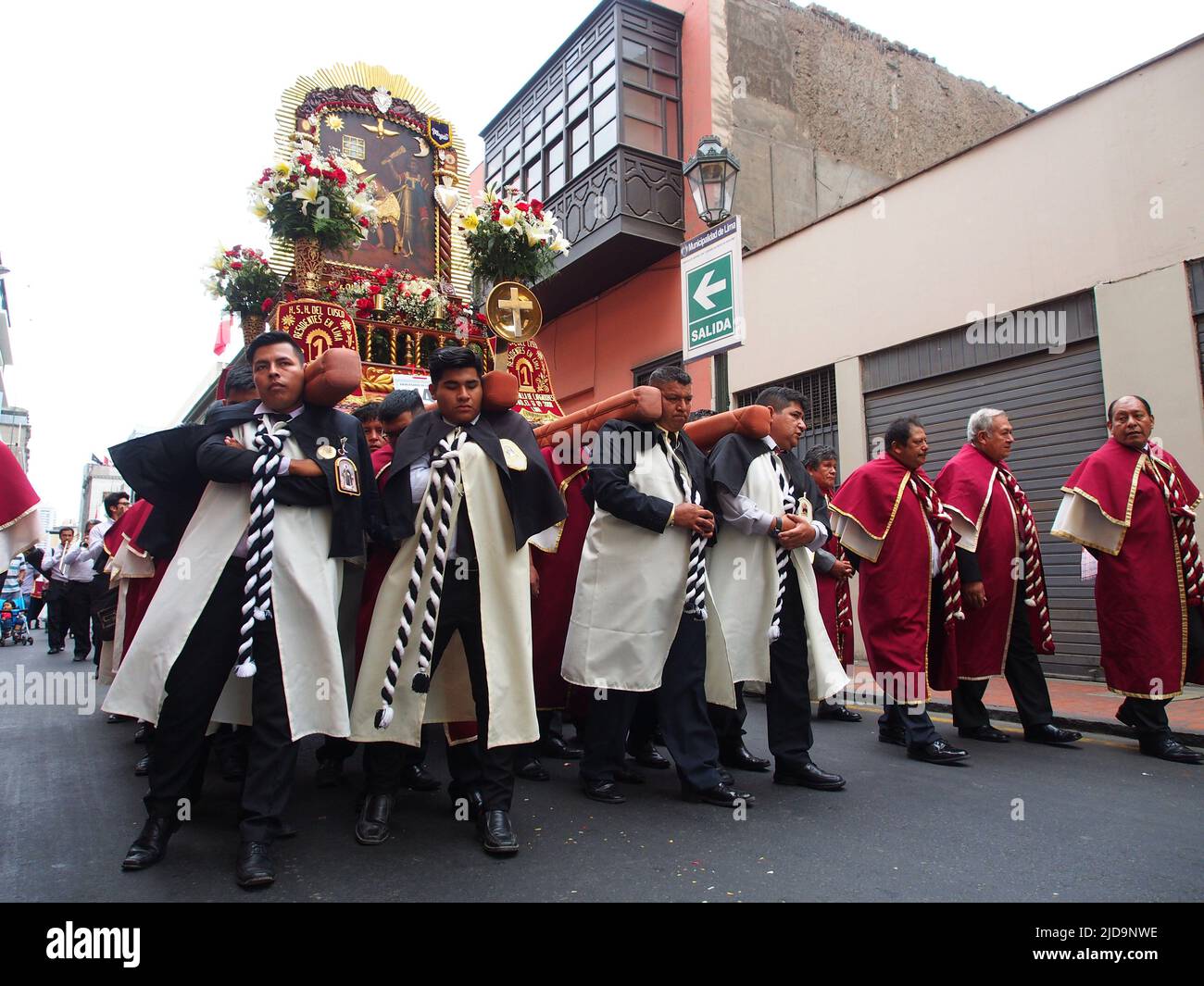 Devotees carrying a religious litter when hundreds of Quechua-speaking ...