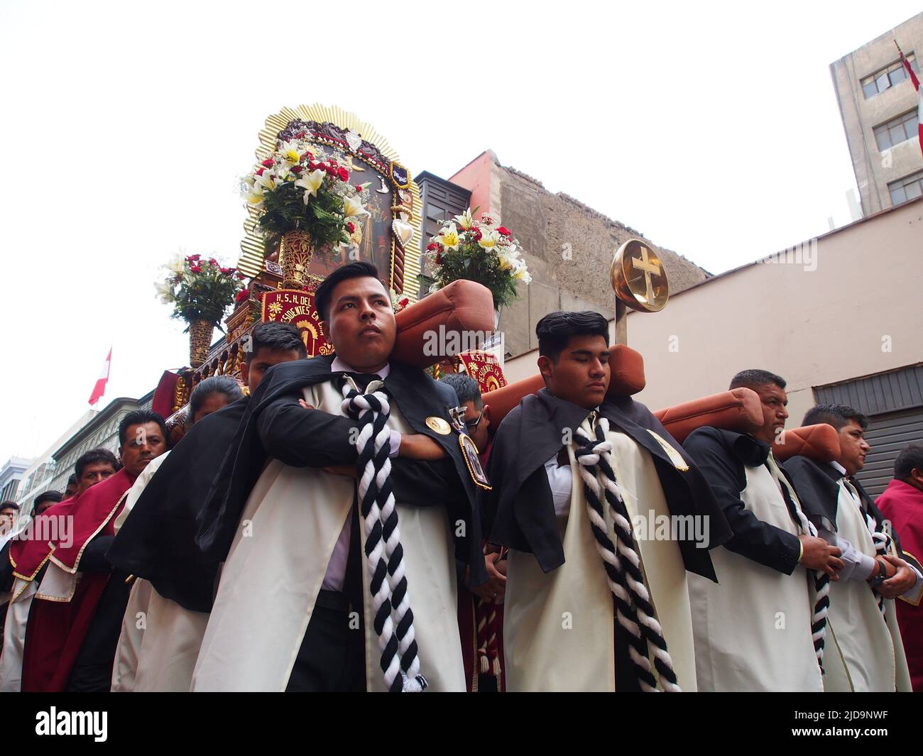 Devotees carrying a religious litter when hundreds of Quechua-speaking ...