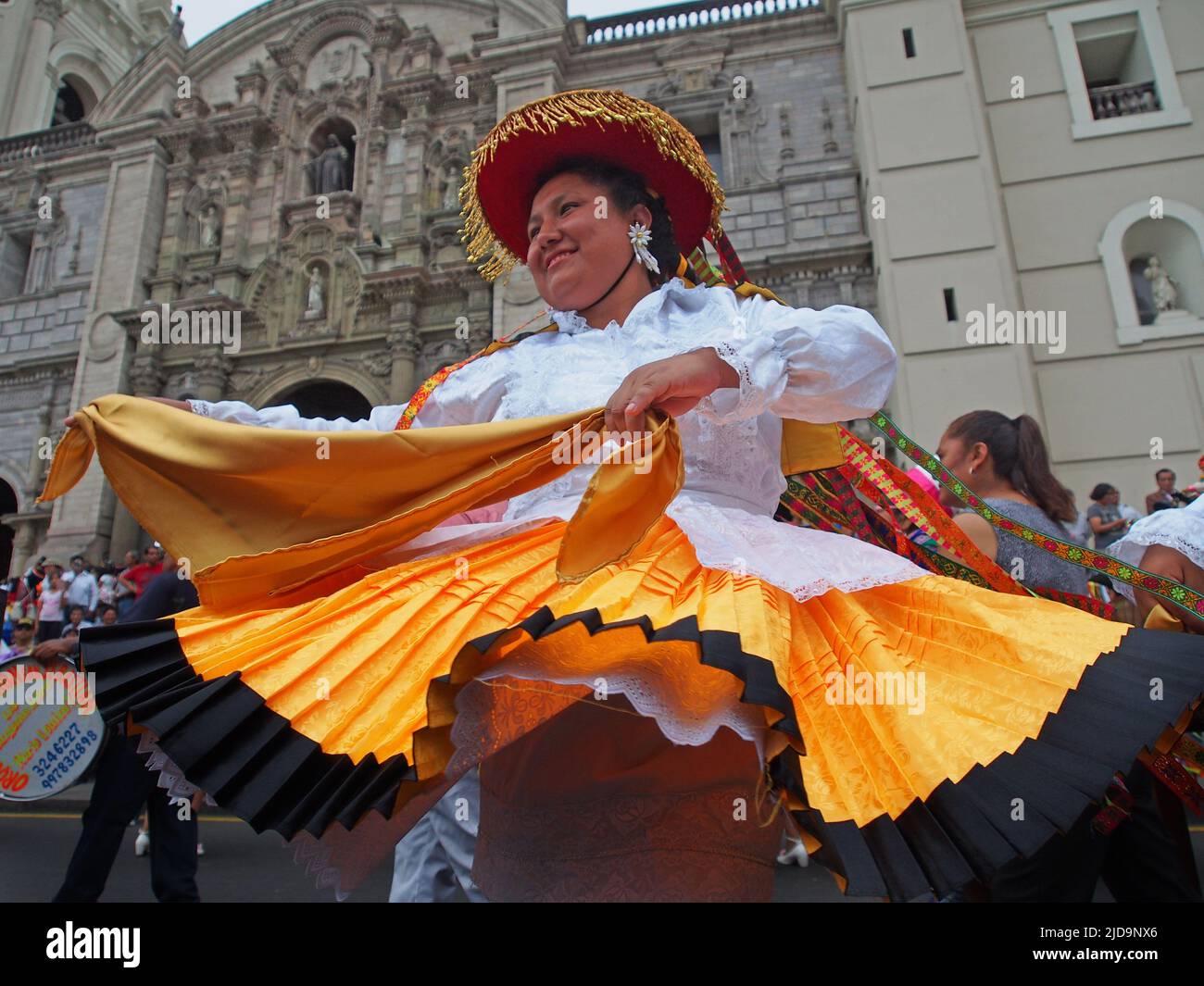 An indigenous woman wearing andean typical costume dancing when ...