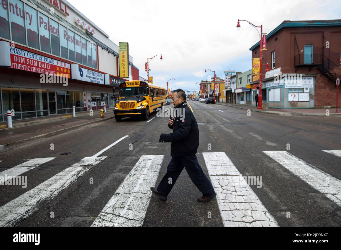 Director of Chinatown BIA, Wen Wong walks the streets of Chinatown in ...