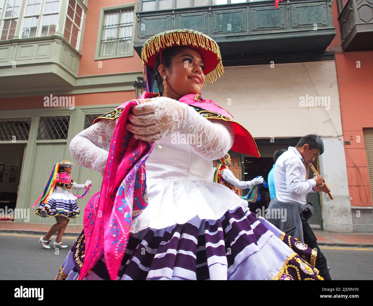 An indigenous woman wearing andean typical costume dancing when ...