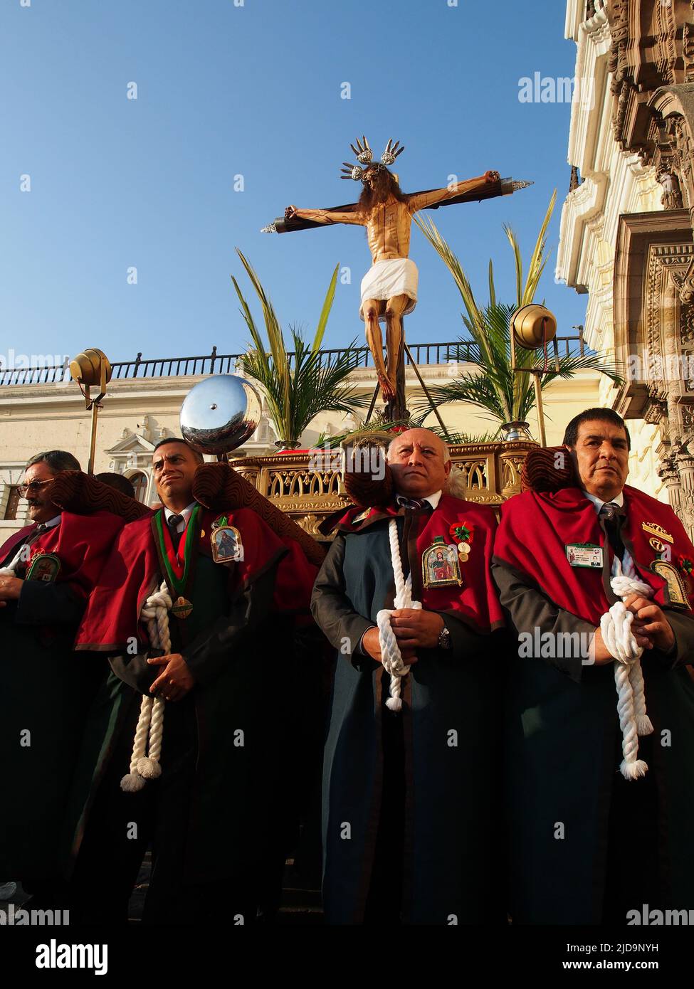 Catholic devotees carrying on a religious procession at eve on Holy ...