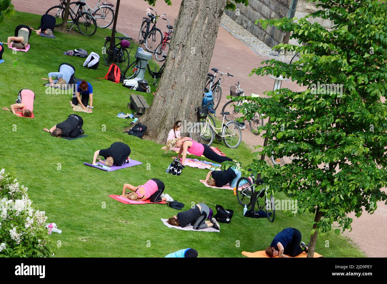 Late afternoon exercise class in the park outside National Museum in ...