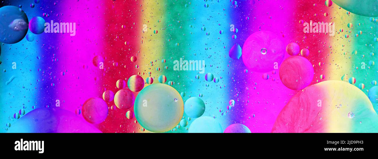 Top-down view of oil bubbles moving over different layers on the water ...
