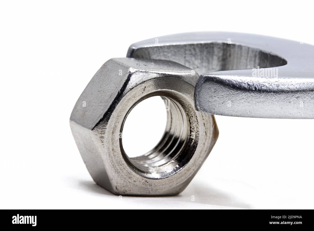 bolt nut and wrench isolated on white background Stock Photo - Alamy