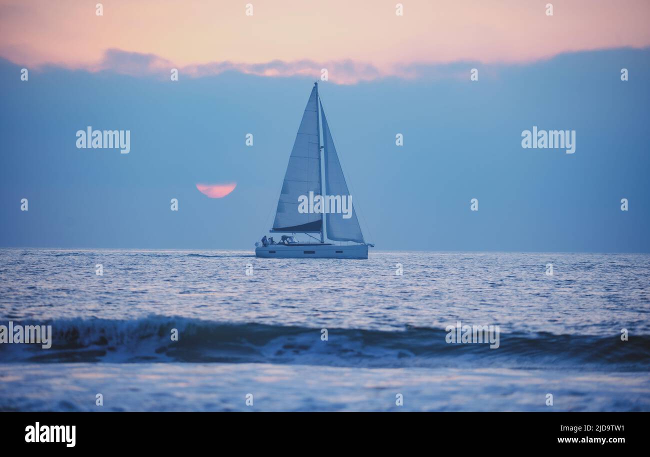 Sailing in the sunrise time with sailboat Stock Photo - Alamy