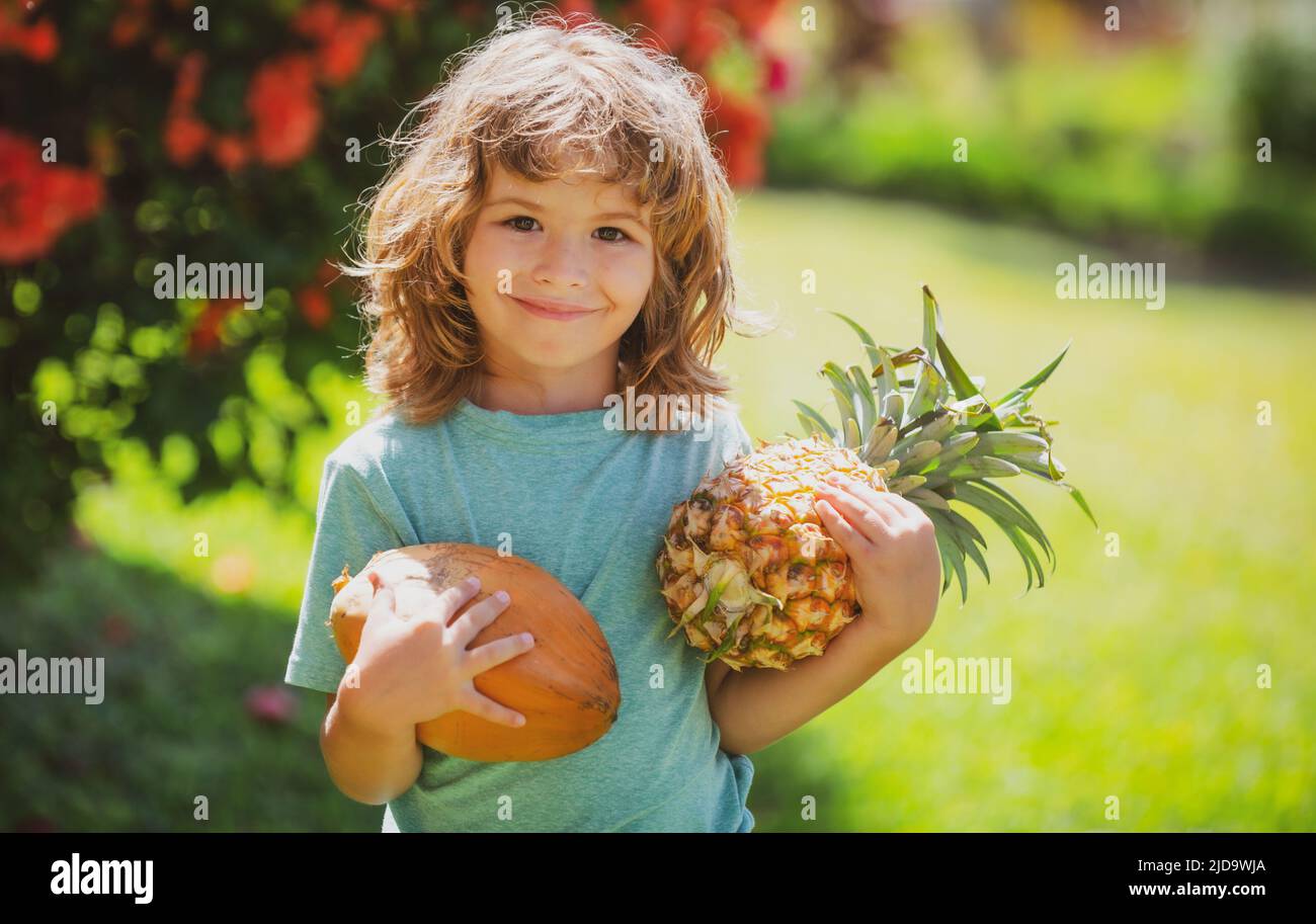 Child with pineapple and coconut. Kid with tropical fruit. Exotic ...