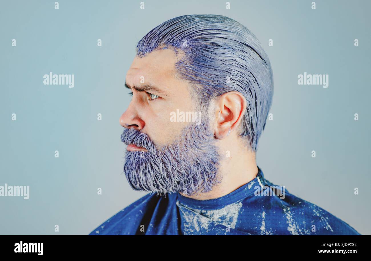 Portrait of man hair coloring. Bearded hipster guy. Process of a man ...