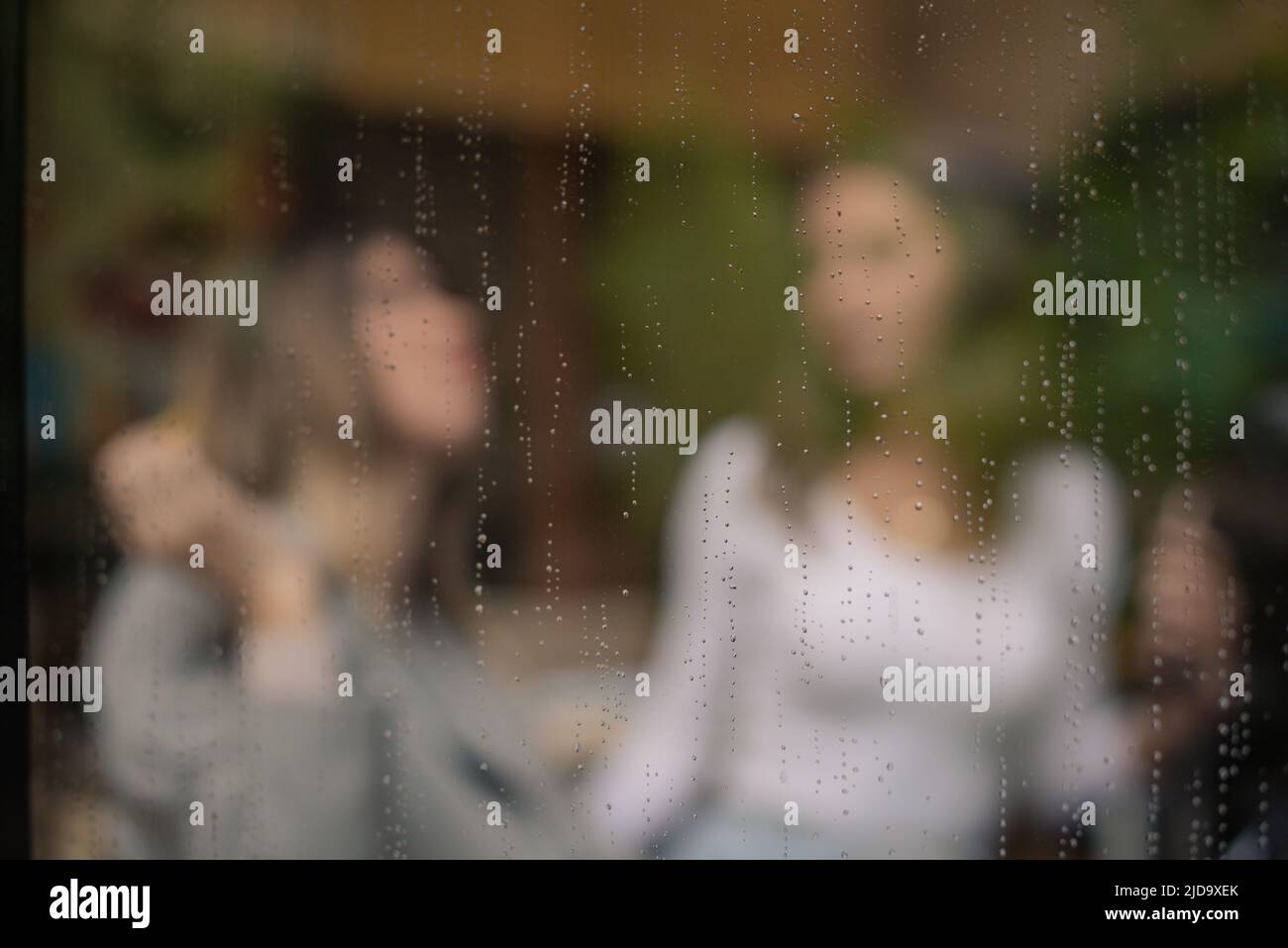 Rain up close people talking hi-res stock photography and images - Alamy