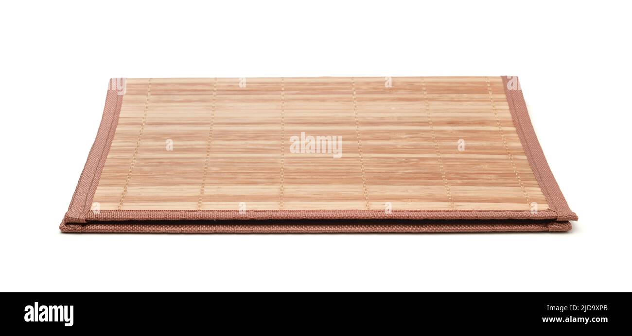 Folded bamboo napkin isolated on white Stock Photo - Alamy