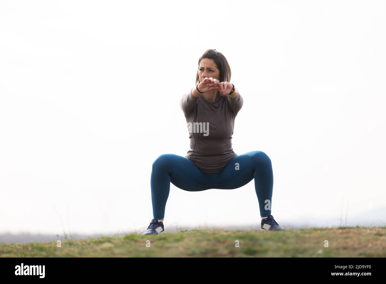 Woman squats rear view hi-res stock photography and images - Alamy